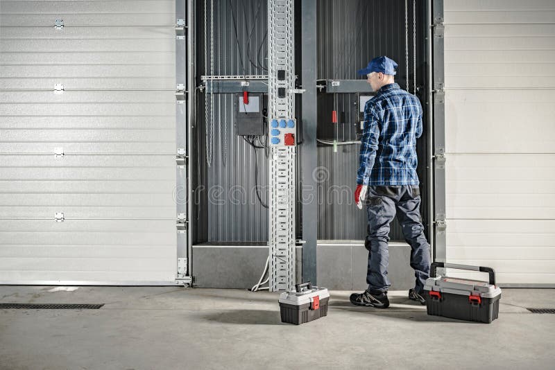 Industrial Warehouse Gate Technician at Work Stock Image - Image of ...