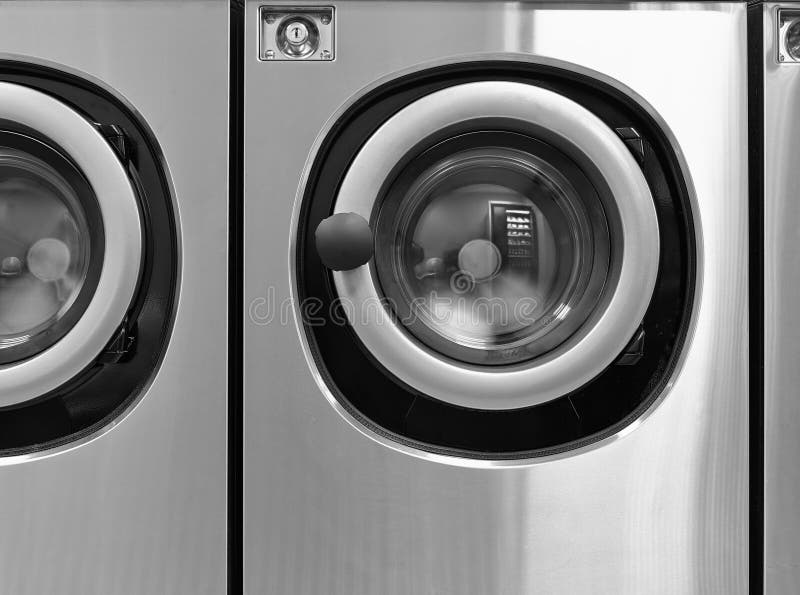 A Row Of Industrial Washing Machines Stock Image - Image of laundrette ...