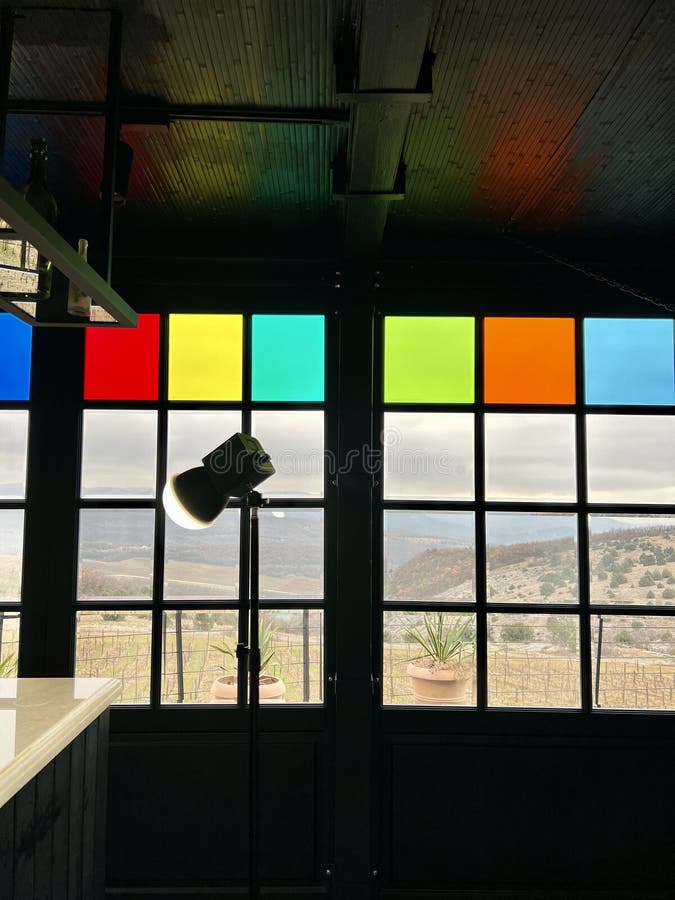 Industrial Window with Colorful Panels and a Scenic View Outside Stock ...