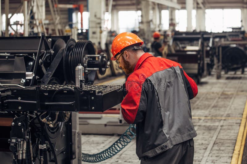 Industrial Worker Assembles Agricultural Machine in Workshop Stock ...