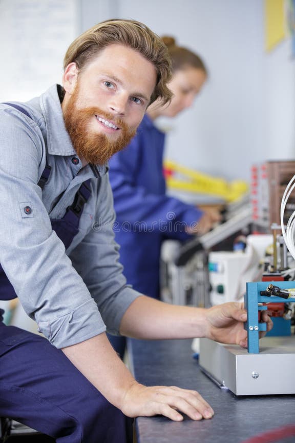 Industrial Worker Assembles Electronic Components in Factory Stock ...