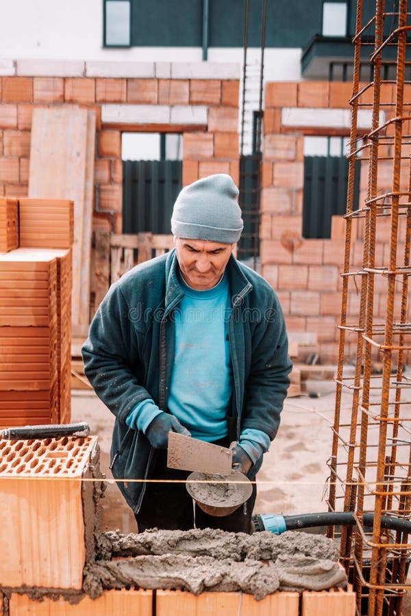 Industrial Worker, Bricklayer and Mason Working with Bricks and ...