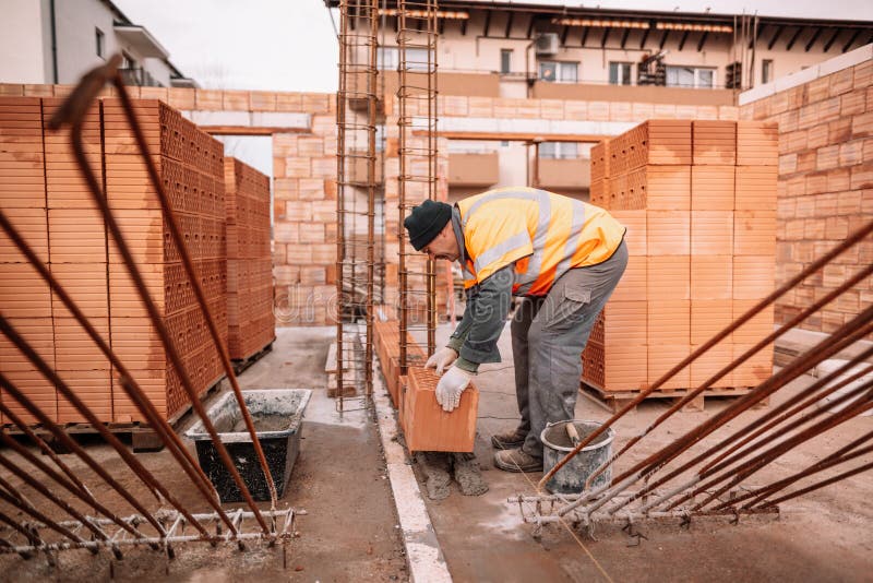 Industrial Worker, Bricklayer and Mason Working with Bricks Stock Photo ...