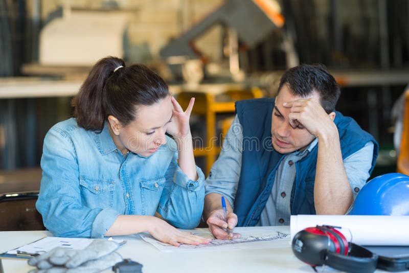 Industrial Worker and Client Studying Possible Design Stock Photo ...