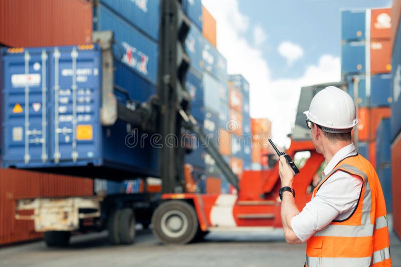Industrial Worker is Controlling Container Loading by Walkie Talkie ...