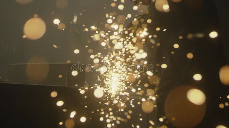 Industrial Worker Cutting Metal with Many Sharp Sparks. Male Using ...