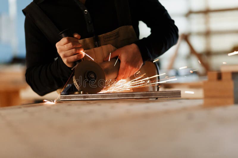 Industrial Worker Cutting Metal with Many Sharp Sparks. Selection Focus ...