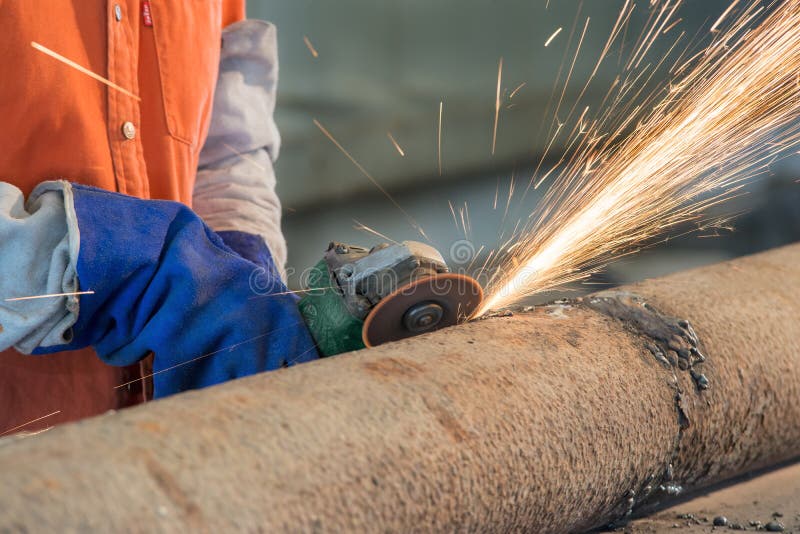 Industrial Worker Cutting and Welding Metal with Many Sharp Spar Stock ...