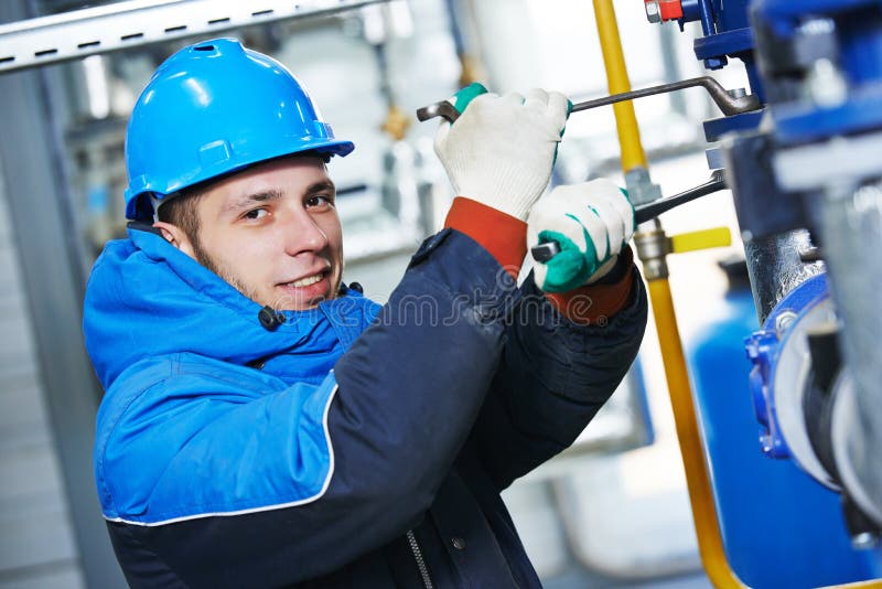 Industrial Plumber Assembling Pipes, Valves, Faucets in Water ...