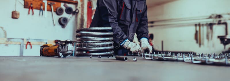 An Industrial Worker Processing Iron Structures and Preparing Them for ...