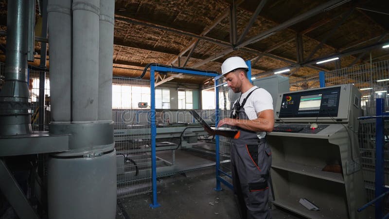 Industrial Worker Programmer Sets Up Production Line Conveyor with ...