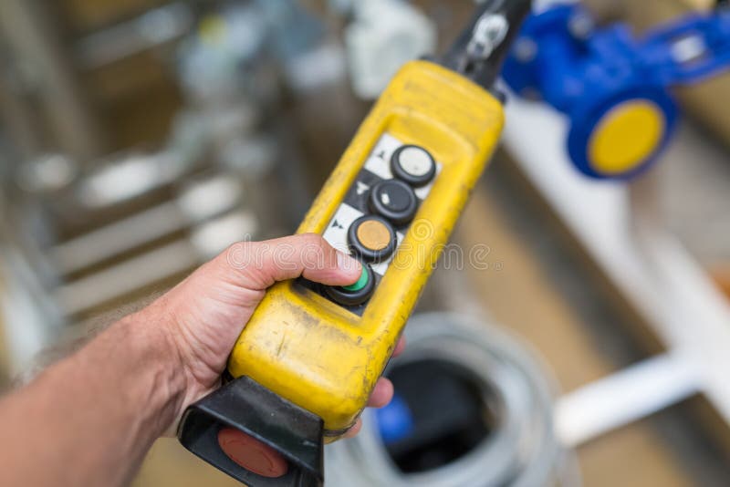 Industrial Worker Pushing on Button of Machinery Controler. Stock Image ...