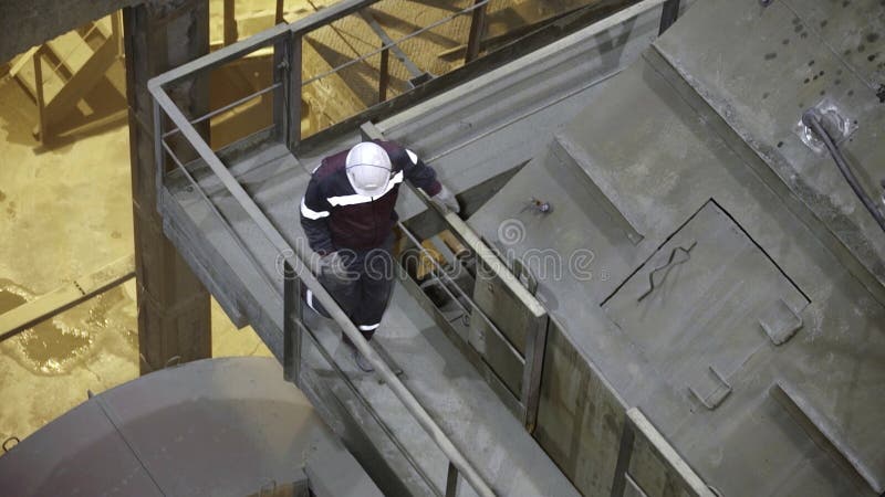An Industrial Worker Skillfully Navigating a Busy Construction Site ...
