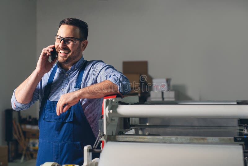 Industrial Worker Talking on Cell Phone. Stock Image - Image of ...