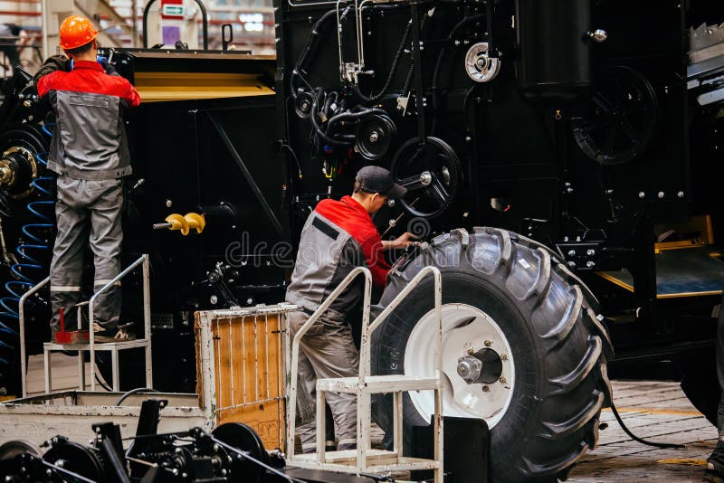 Industrial Workers Assembles Agricultural Harvester in Workshop Stock ...
