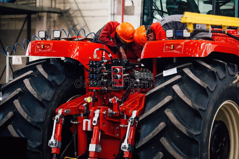Industrial Workers Assembles Agricultural Tractor in Workshop Stock ...