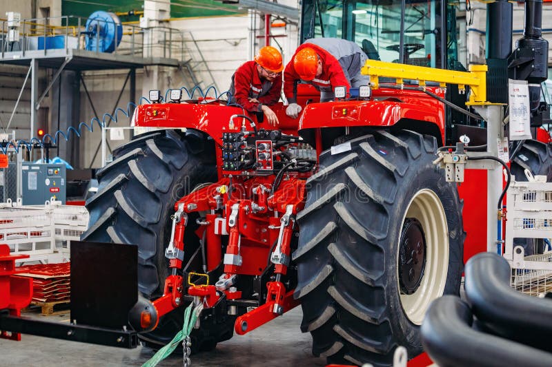 Industrial Workers Assembles Agricultural Tractor in Workshop Stock ...