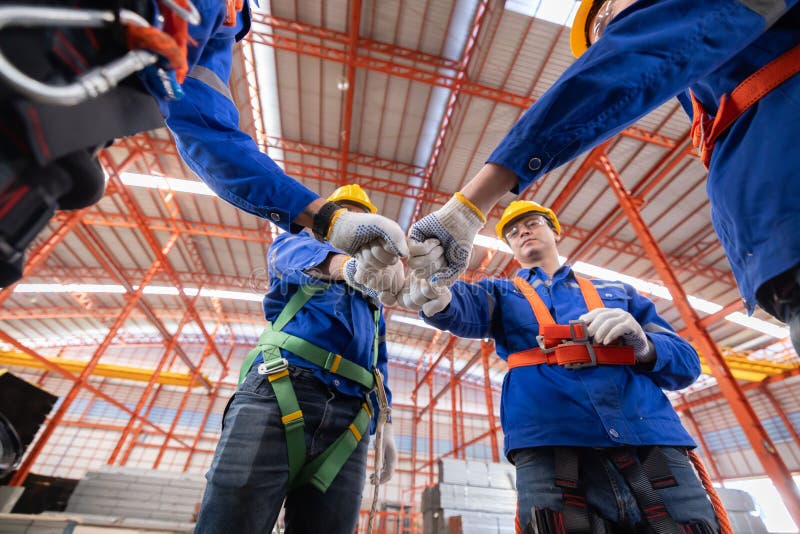 Industrial Workers Standing with Fist Bump Gesture Showing Their ...