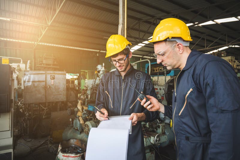 Industrial Workers are Working on Projects in Large Industrial Plants ...