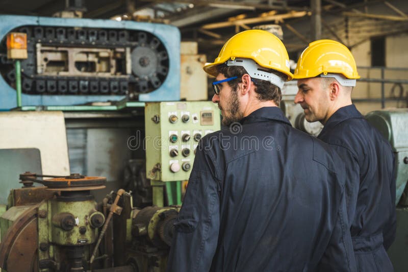 Industrial Workers are Working on Projects in Large Industrial Plants ...