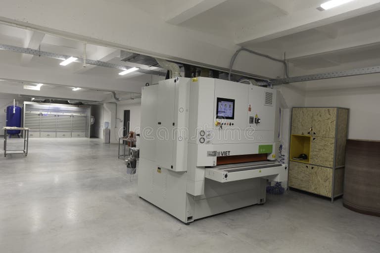 Industrial Workshop with Advanced Sanding Machine in Modern Facility ...