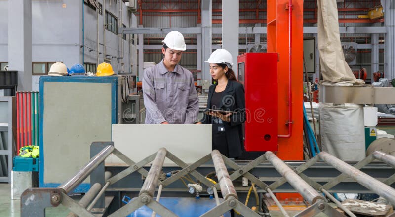 Industrious Worker Meticulously Operating Complex Machinery within a ...