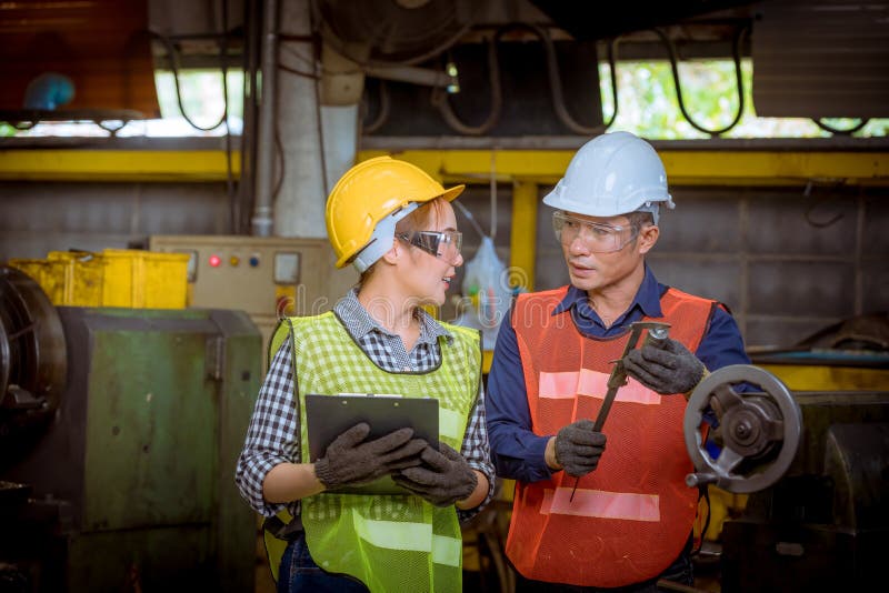 Industry Engineer Under Inspection and Checking Production Process on ...