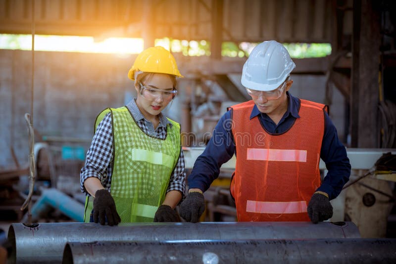 Industry Engineer Under Inspection and Checking Production Process on ...
