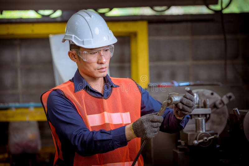 Industry Engineer Under Inspection and Checking Production Process on ...