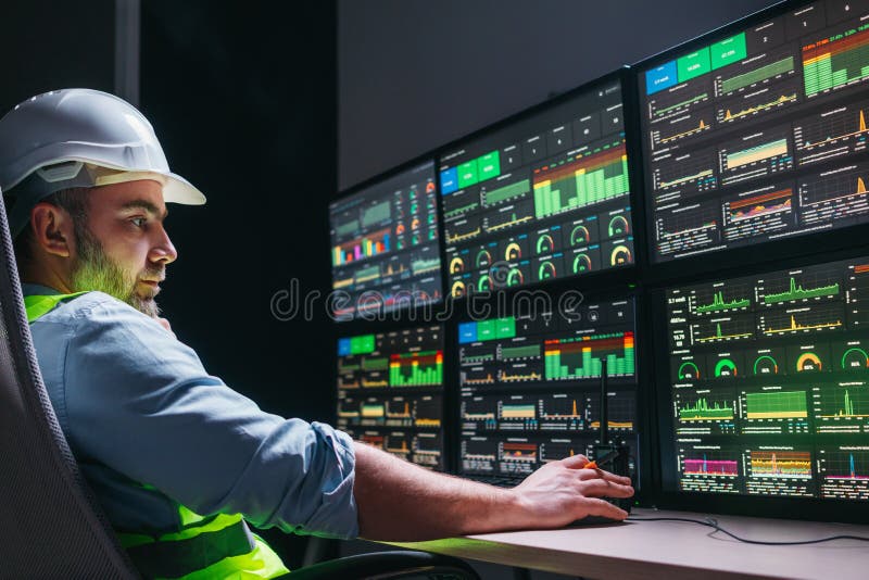 Industry 4.0. Head Engineer Control Production Line with Computer ...