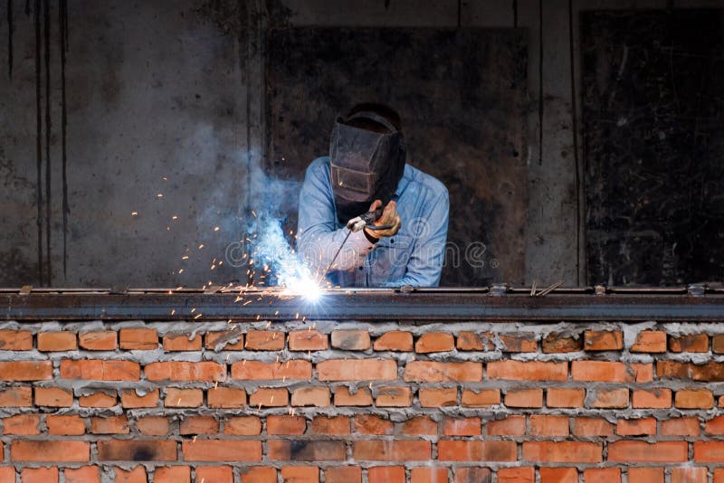 Industry Worker Welding Iron Pieces on New Building Stock Image - Image ...