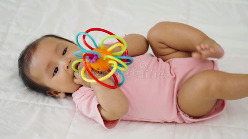 Baby, Biting Toy and Family Bonding with Loving Mom Carrying Girl Child ...