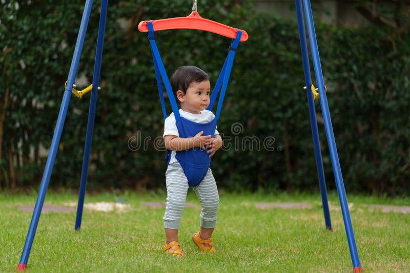 Infant Baby Jumping in Jumper Swing Stock Image - Image of toddler ...
