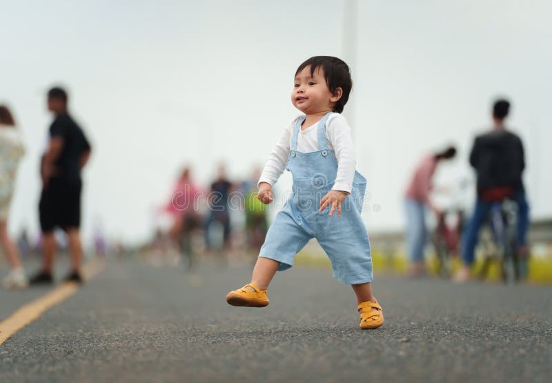 Infant Baby Learning To Walking First Step on Pathway Stock Image ...