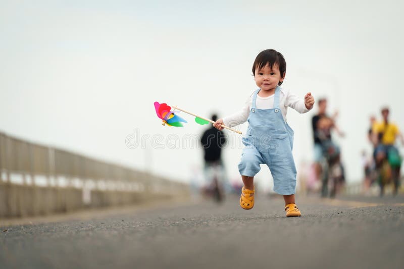 Infant Baby Learning To Walking First Step on Pathway Stock Image ...
