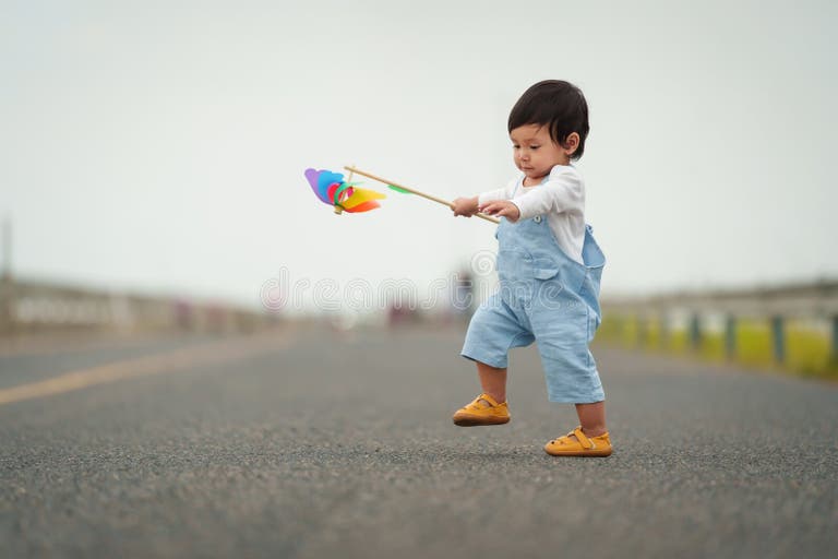 Infant Baby Learning To Walking First Step on Pathway Stock Image ...