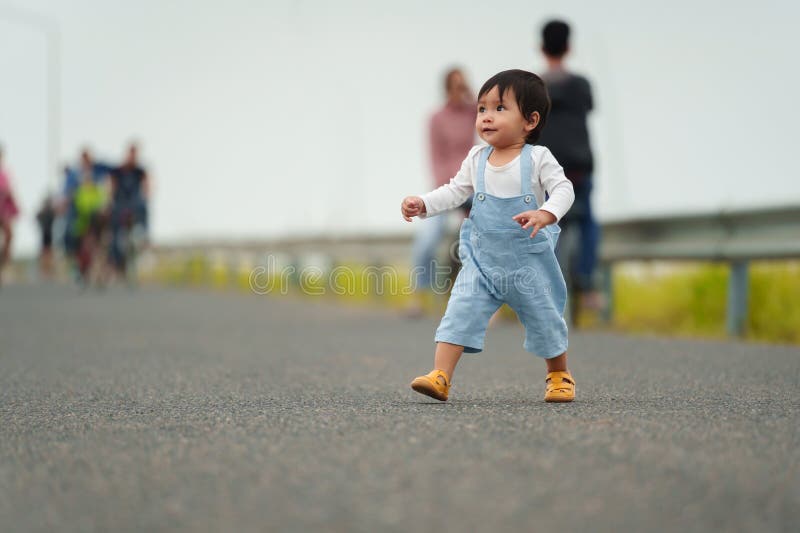 Infant Baby Learning To Walking First Step on Pathway Stock Image ...