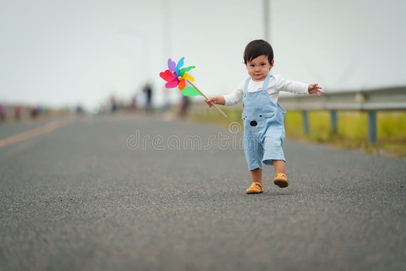 Infant Baby Learning To Walking First Step on Pathway Stock Photo ...
