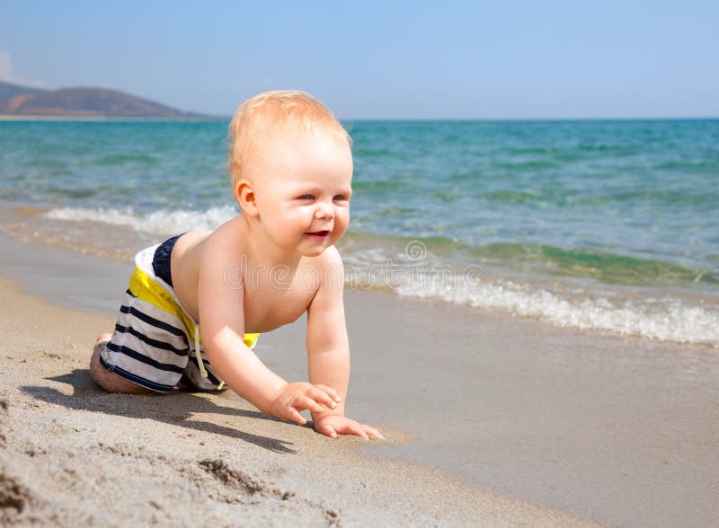 Infant on a beach stock image. Image of caucasian, sand - 39804121