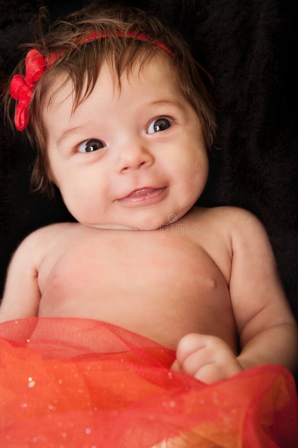 Infant Girl in Red stock image. Image of infant, smile - 19039533