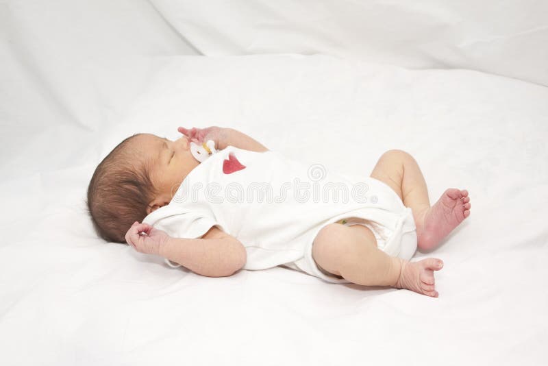 Infant laying on her back stock image. Image of angelface - 16594071