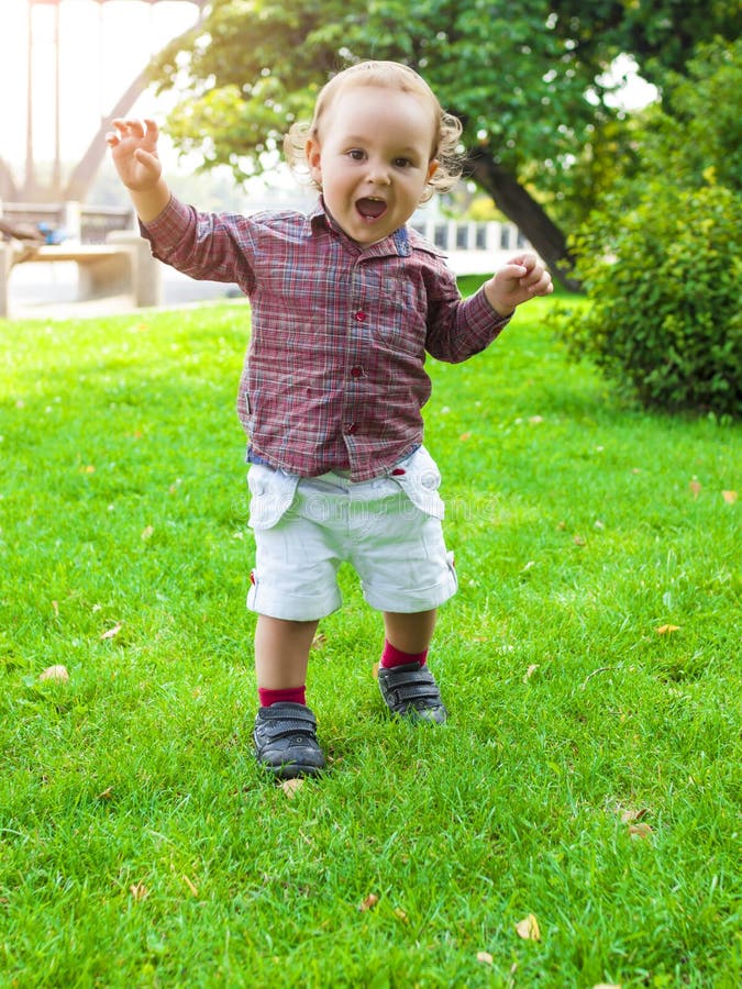 An infant learns to walk. stock photo. Image of healthy - 59042910