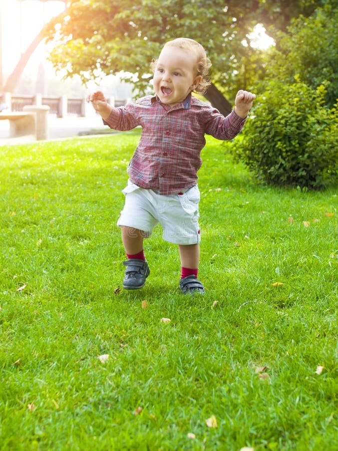 An infant learns to walk. stock image. Image of entertainment - 59044635