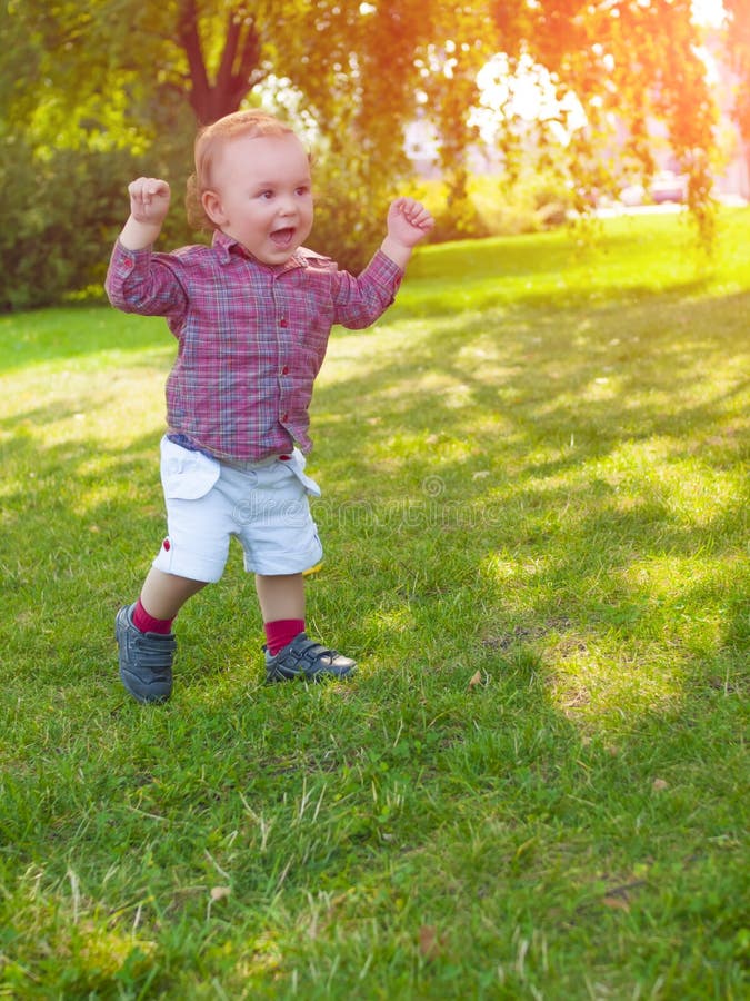 An infant learns to walk. stock image. Image of self - 59231427