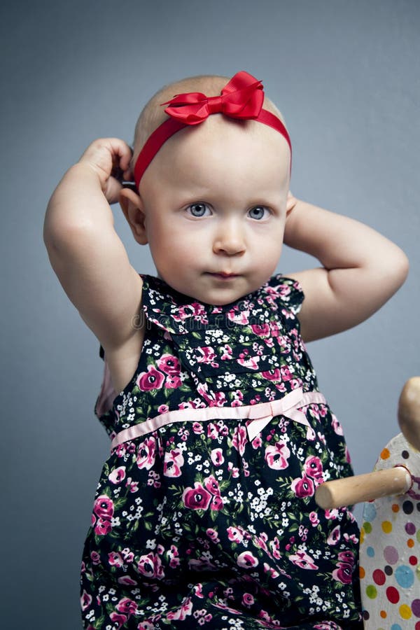 Infant Little Girl with Red Bow Stock Photo - Image of innocent ...