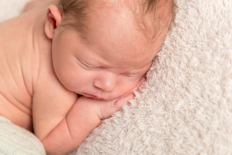 Infant Pressing Hands To His Cheek, Closeup Stock Image - Image of ...