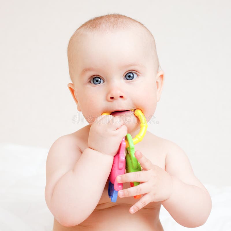 Infant with teething toy stock image. Image of childhood - 10946793