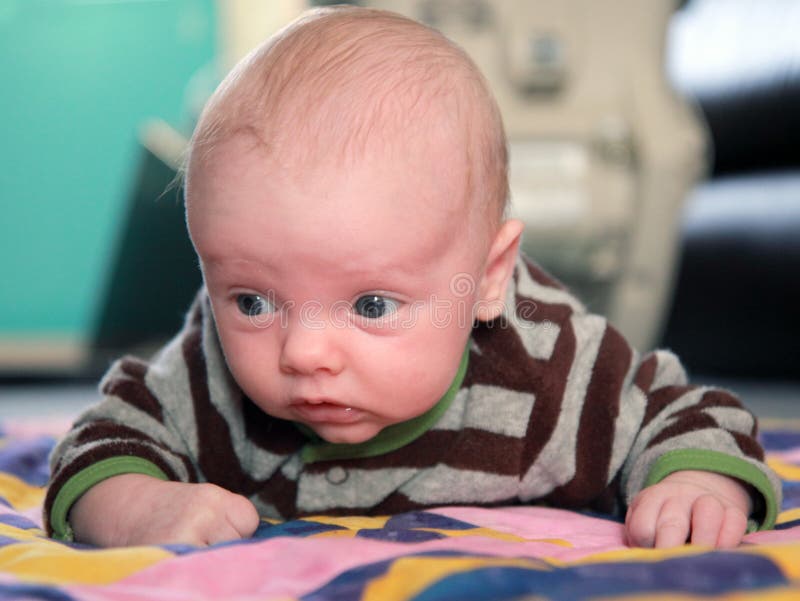 Infant on Tummy stock photo. Image of stare, baby, active - 14720858