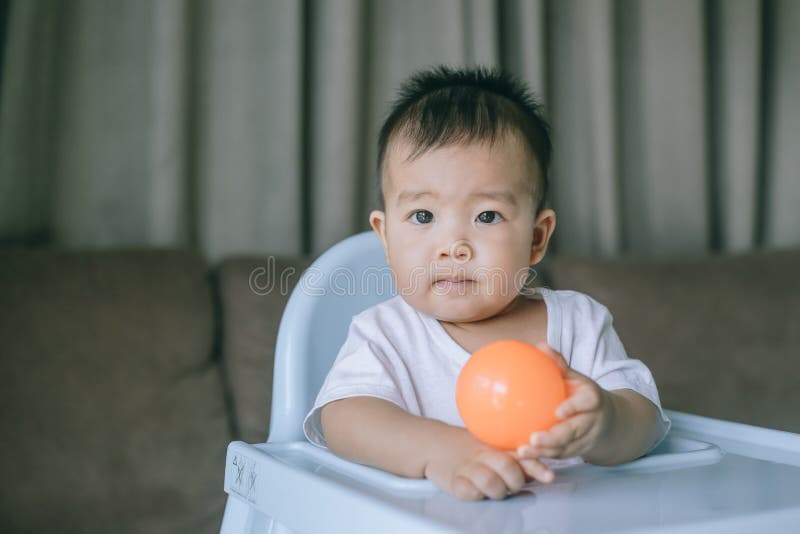 Infants are Playing Ball Happily Inside the House. Stock Image - Image ...