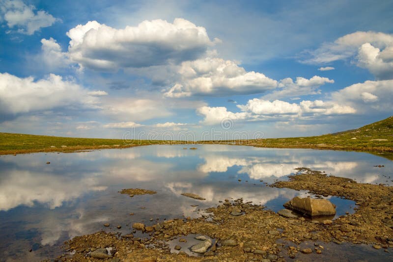 INFINITE Natural Pool with Clouds Stock Photo - Image of rocks, pool ...